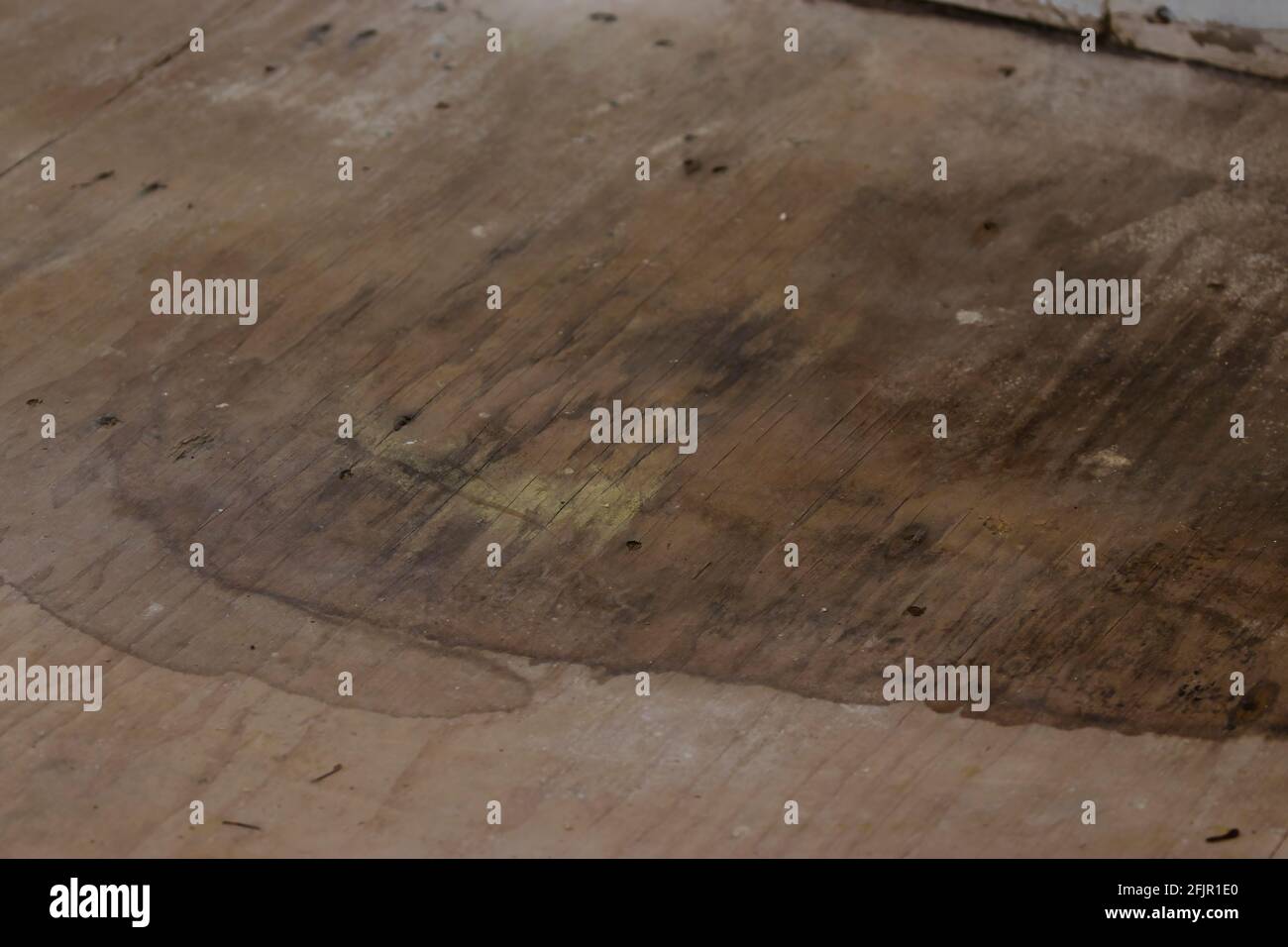 old sub flooring with dark water damage stains Stock Photo - Alamy