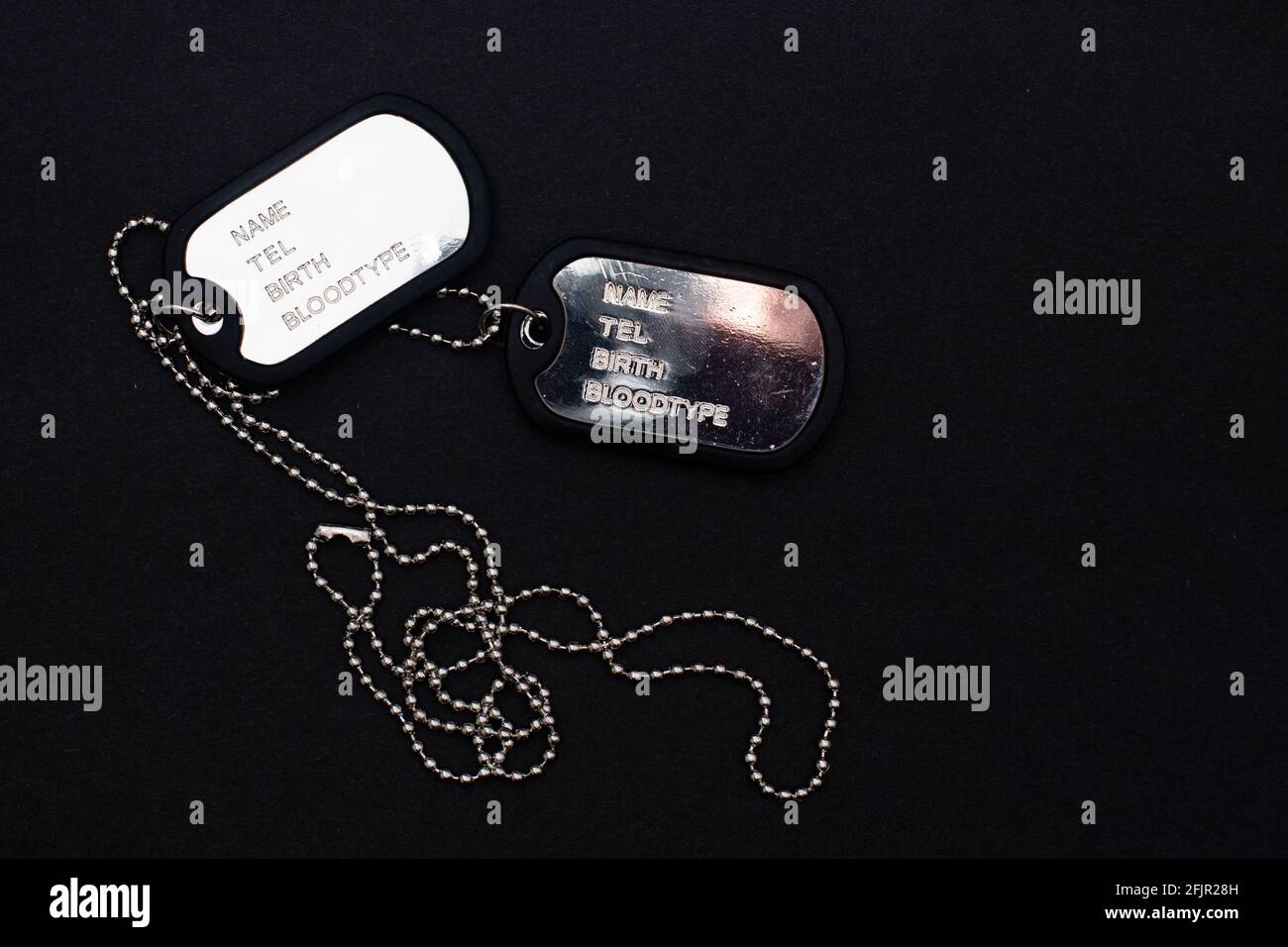dog tag, army chains, army badge on the dark background Stock Photo - Alamy