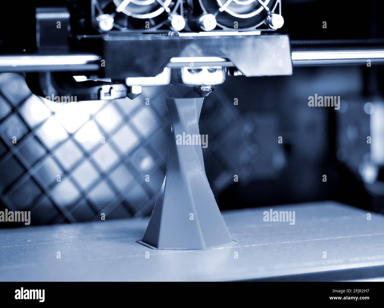 3D printer printing isolated volume triangular object blue gray color ...