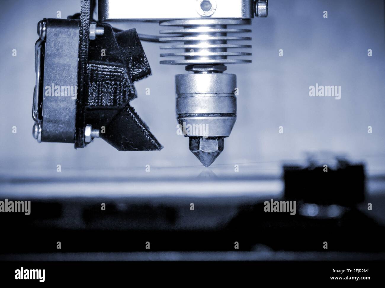 Modern 3D printer printing figure close-up. Automatic three dimensional ...