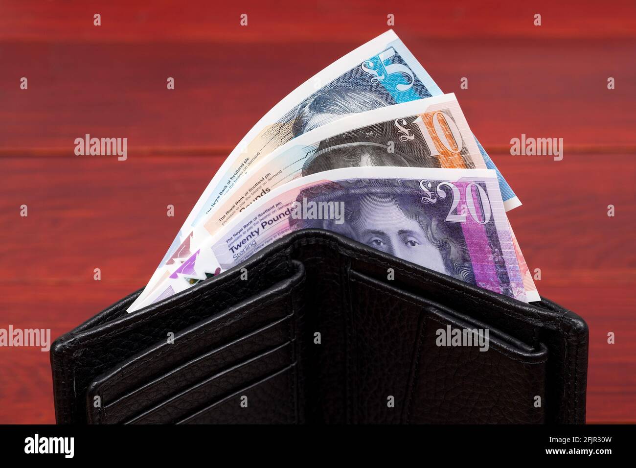 Scottish money - Pounds in a black wallet Stock Photo - Alamy