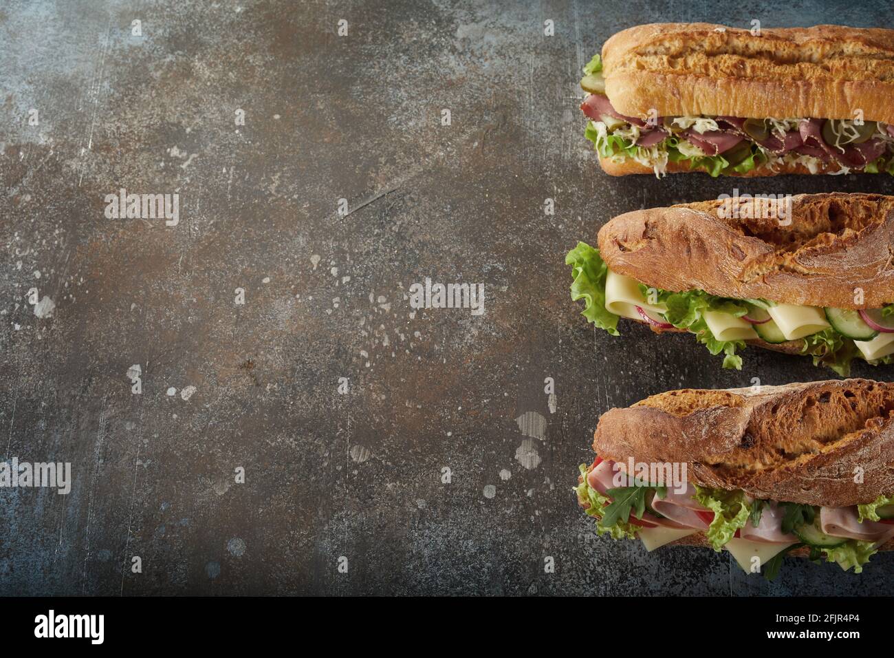 From above yummy sub sandwiches with fresh ingredients and crunchy ...