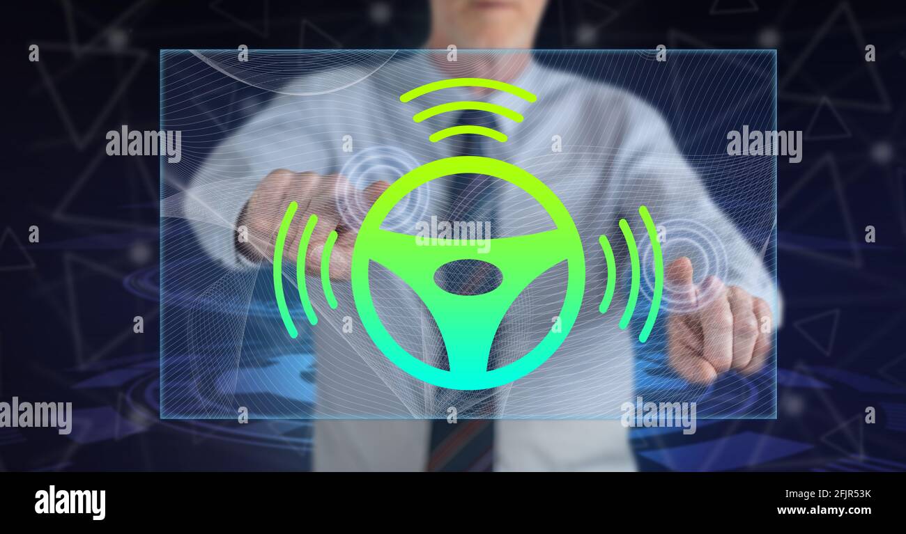Man touching a self-driving car concept on a touch screen with his ...