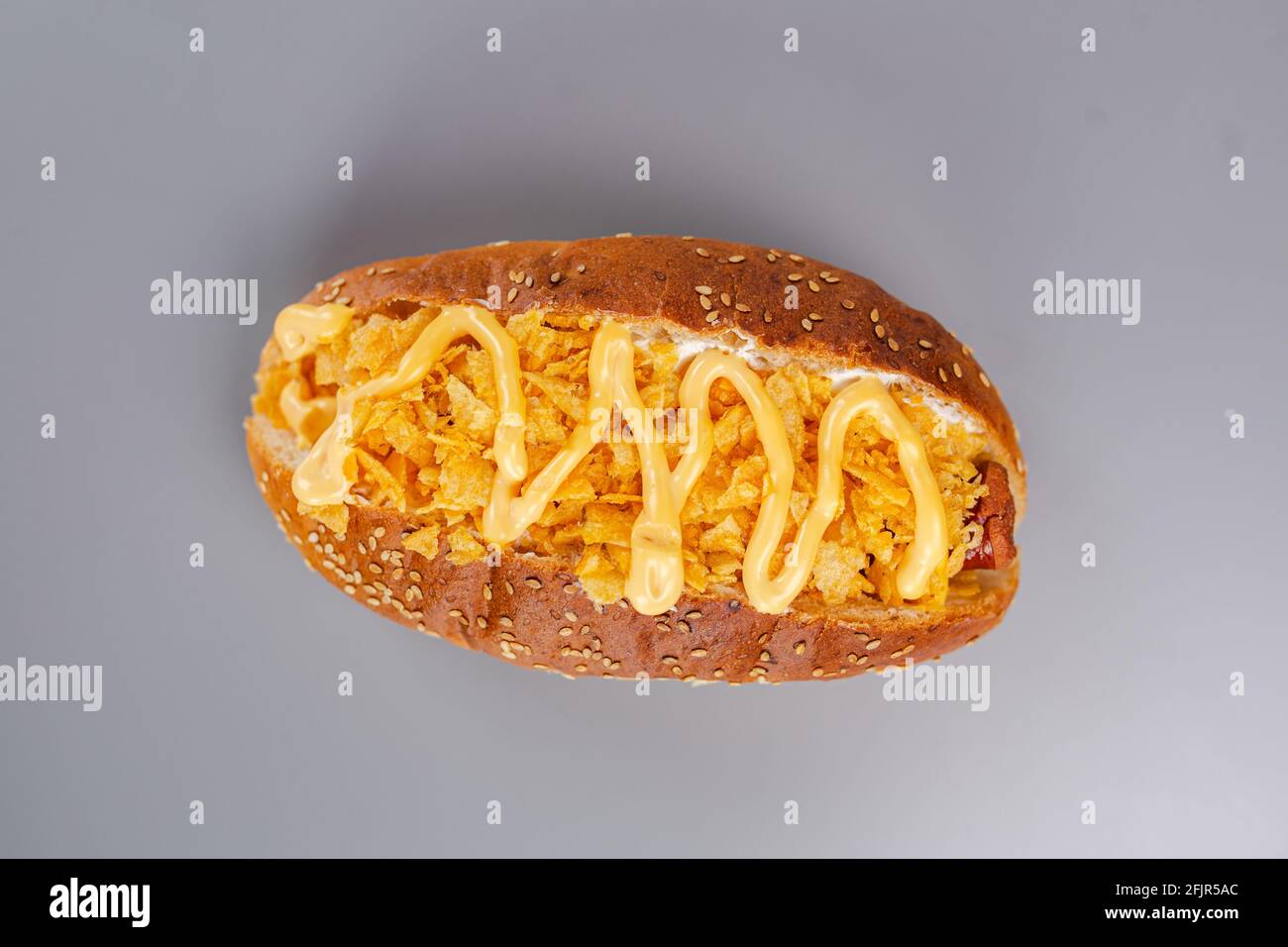 View from top running dog with sausage and chips Stock Photo - Alamy