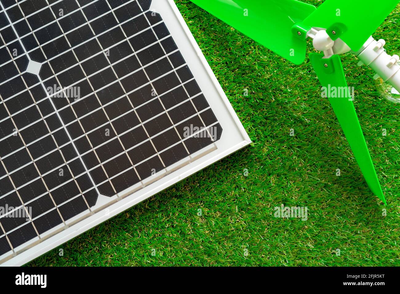 Models of windmill and solar panel, alternative energy sources Stock ...