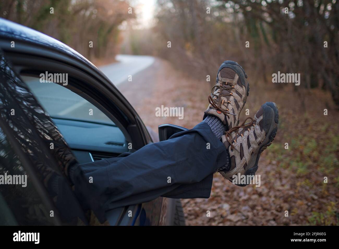 Legs sticking out of car hi-res stock photography and images - Alamy