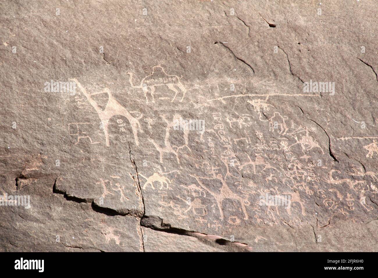 Prehistoric rock painting petroglyphs depicting humans and camels, Wadi ...