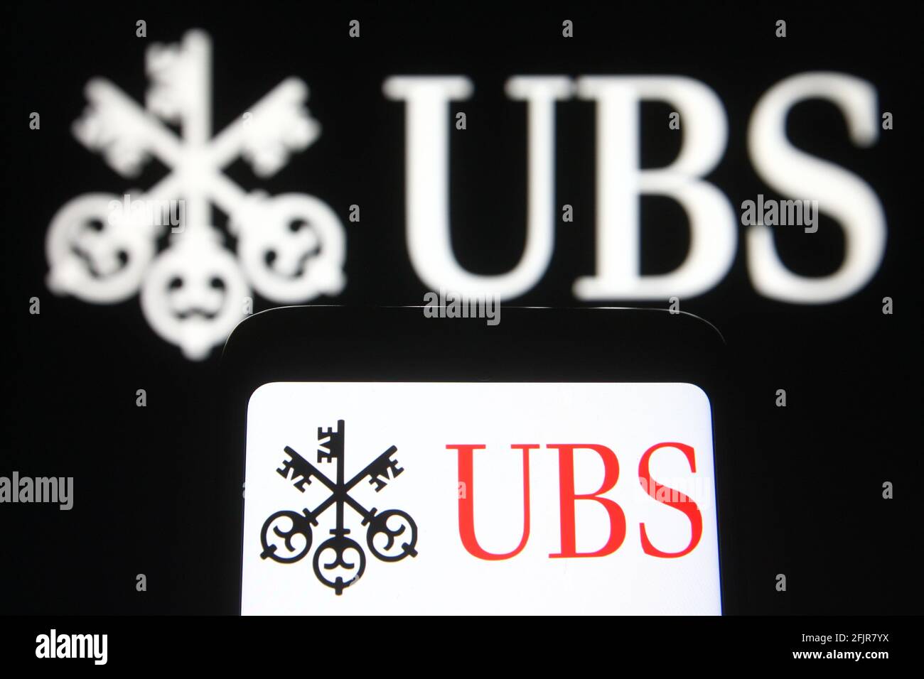 In this photo illustration, the UBS logo of a Swiss investment bank and ...
