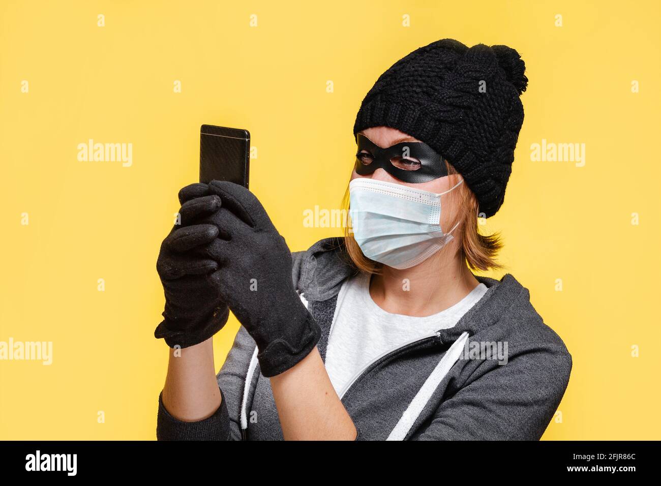 Female hacker in black mask hi-res stock photography and images - Alamy