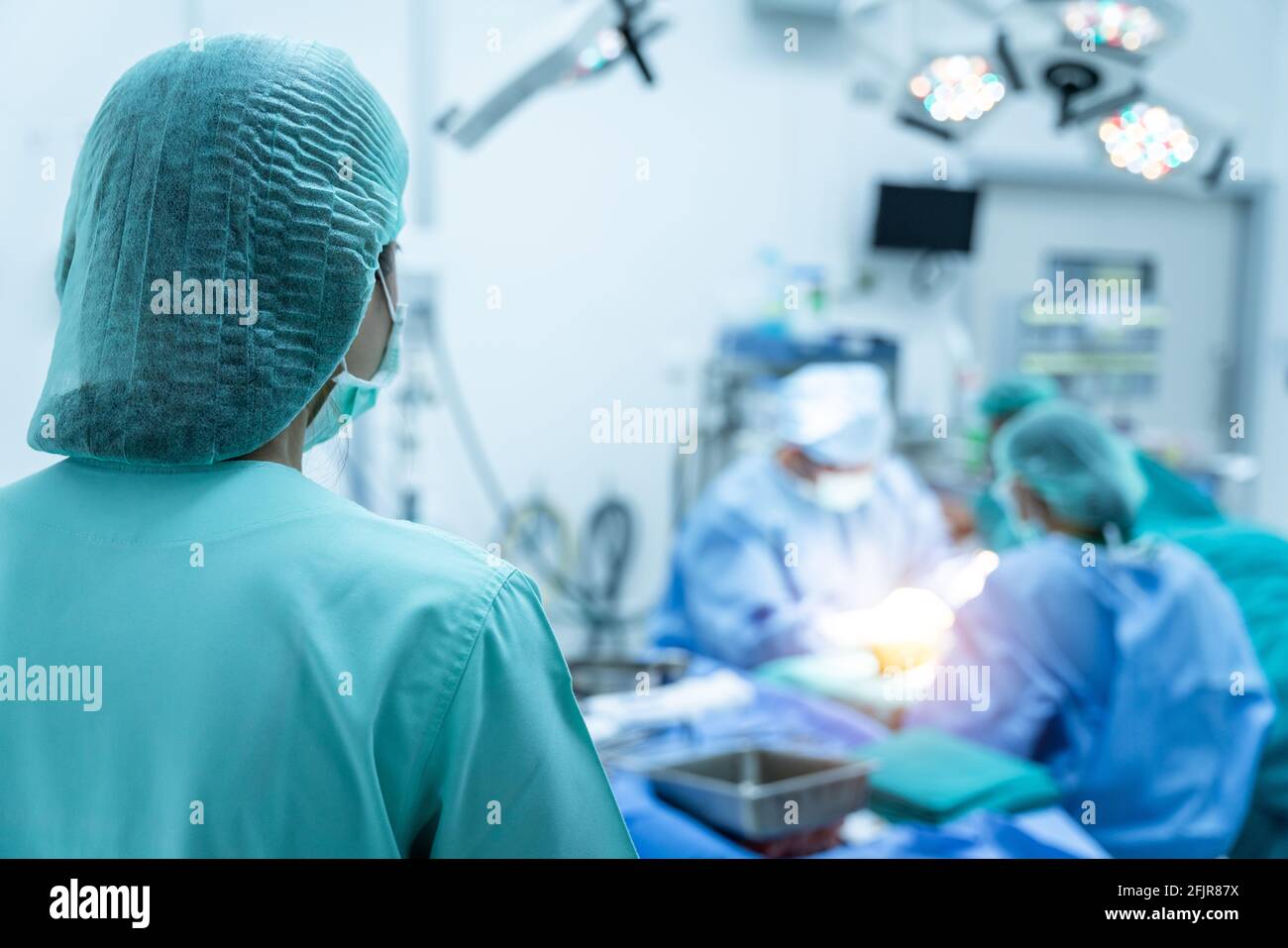 assistant or staff of Team surgeon at work in operating room Stock ...