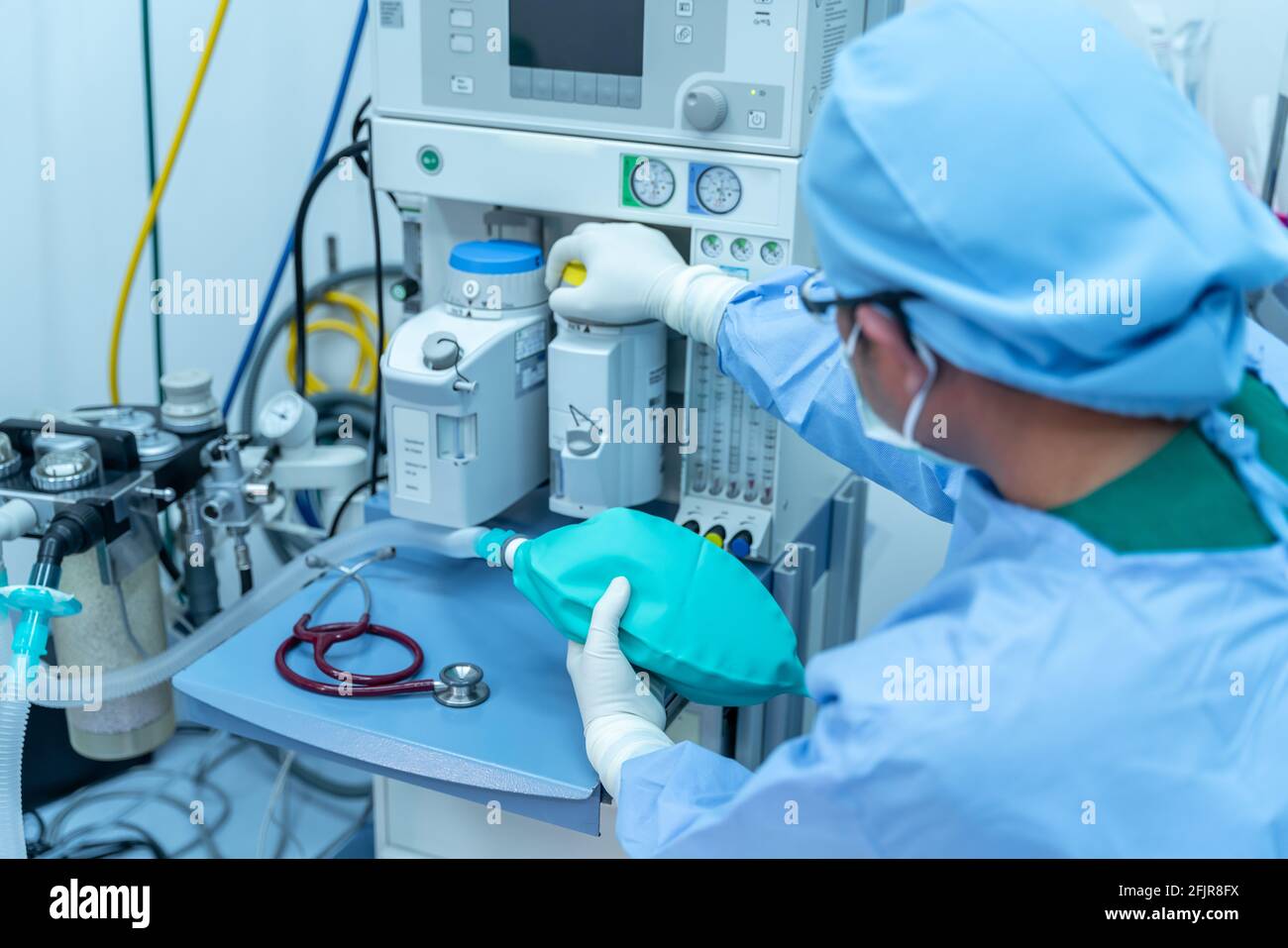 assistant working heart rate surgeon's team in uniform performs an ...