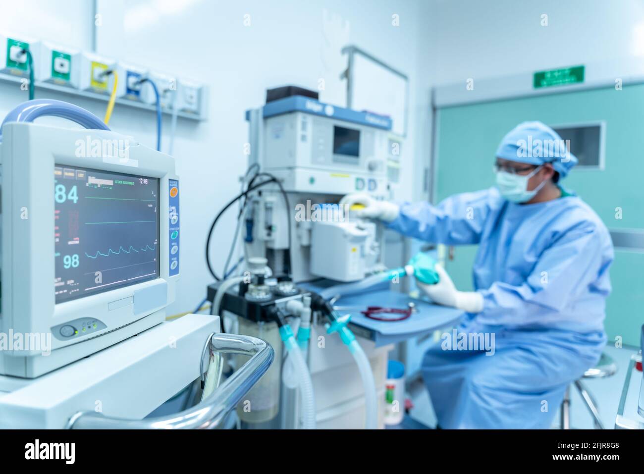 Selective focus of monitor, assistant working heart rate monitor ...