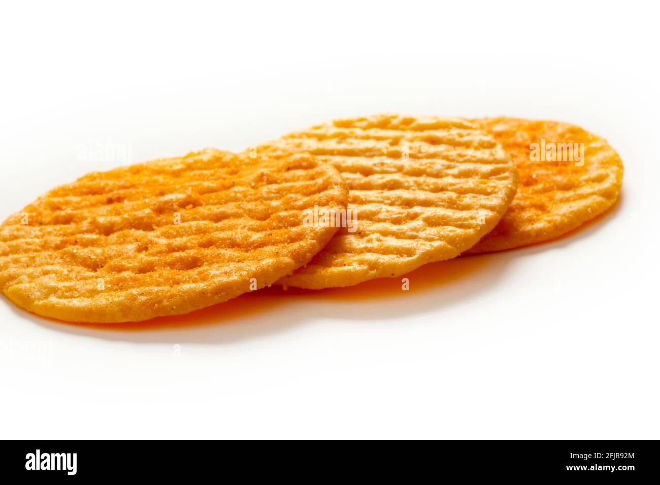 Crispy spicy crackers on white background Stock Photo - Alamy