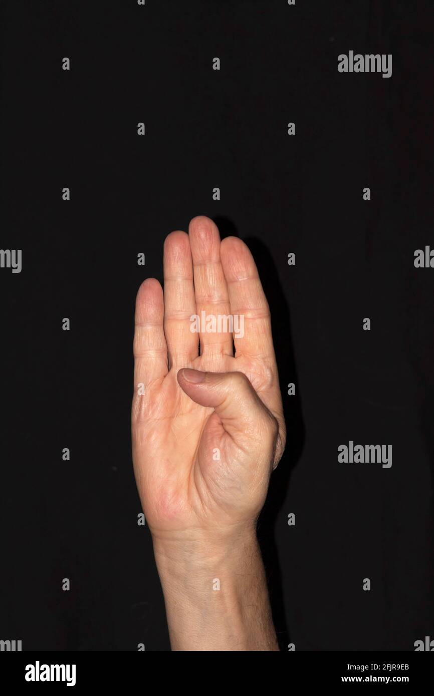 Muslim hand sign Stock Photo - Alamy