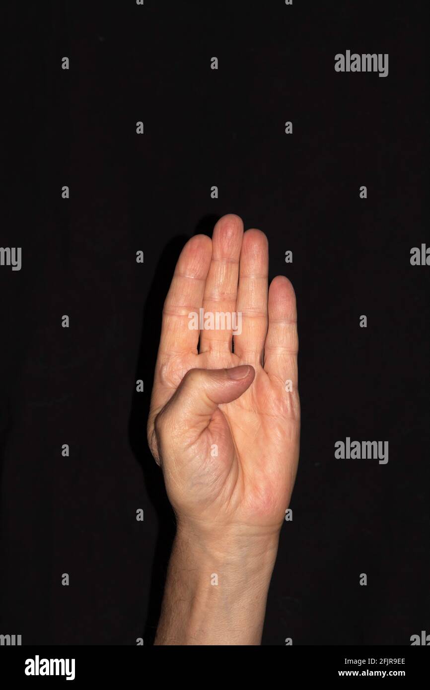 Muslim hand sign Stock Photo - Alamy