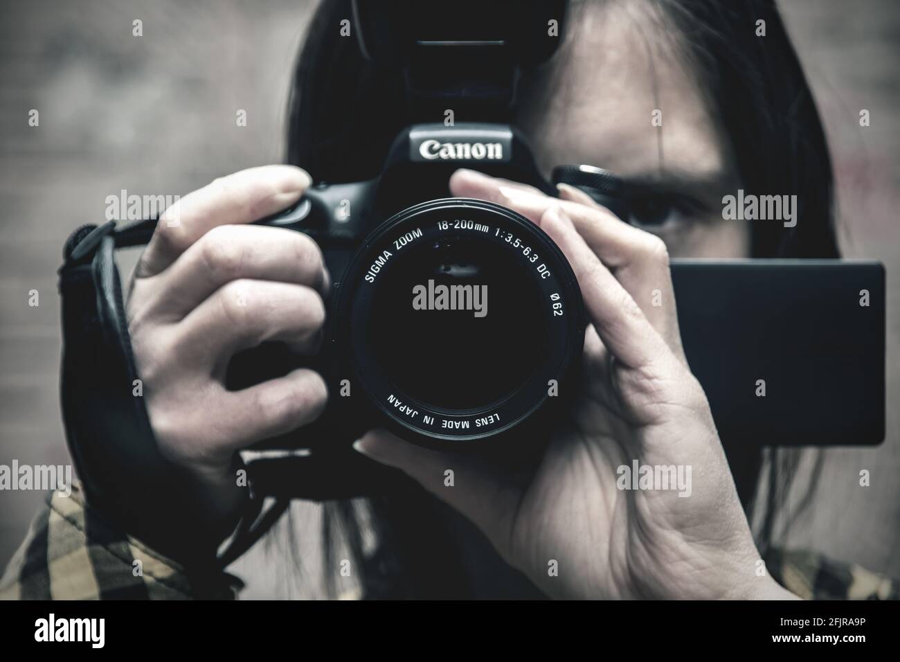 Woman taking photo canon camera hi-res stock photography and images - Alamy