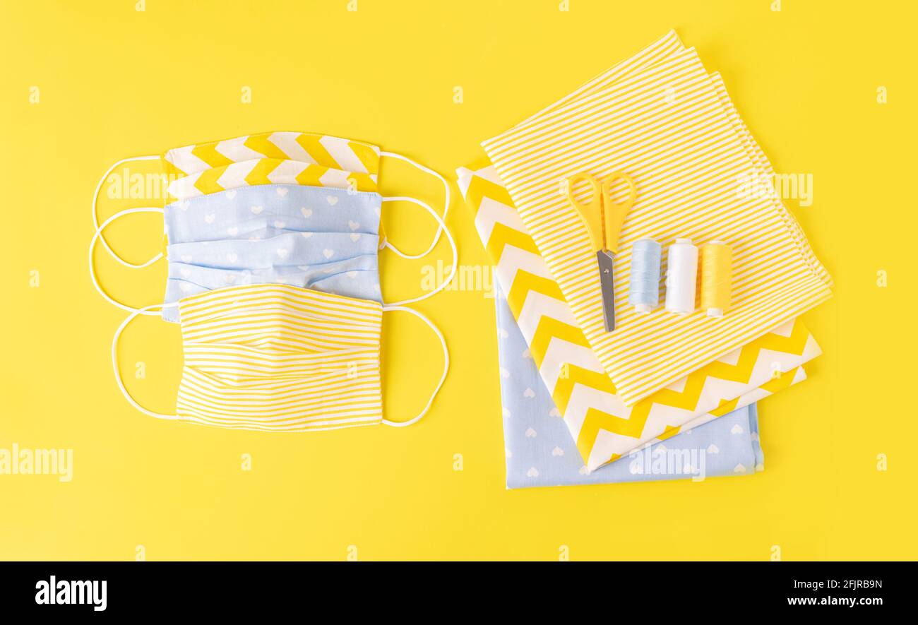 Eco-friendly reusable cloth face shield and sewing accessories on top ...