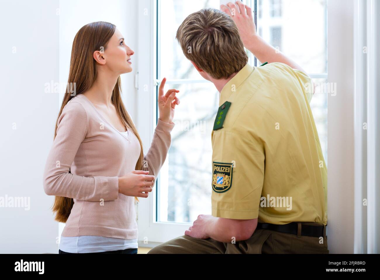 Police officer preserving evidence after burglary in apartment Stock ...