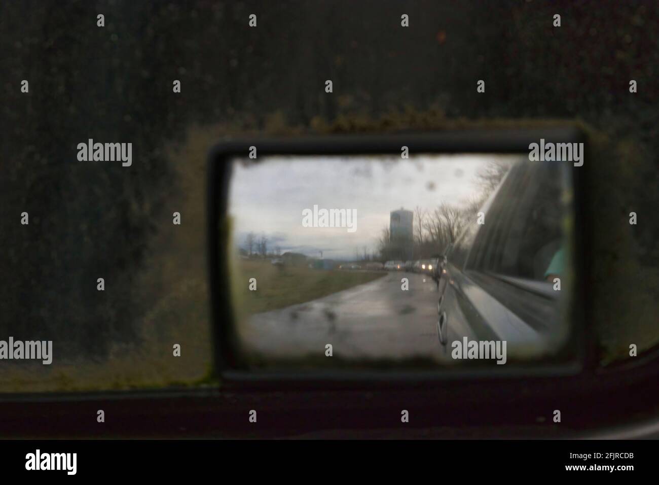 veiw through a grimy old car mirror Stock Photo - Alamy