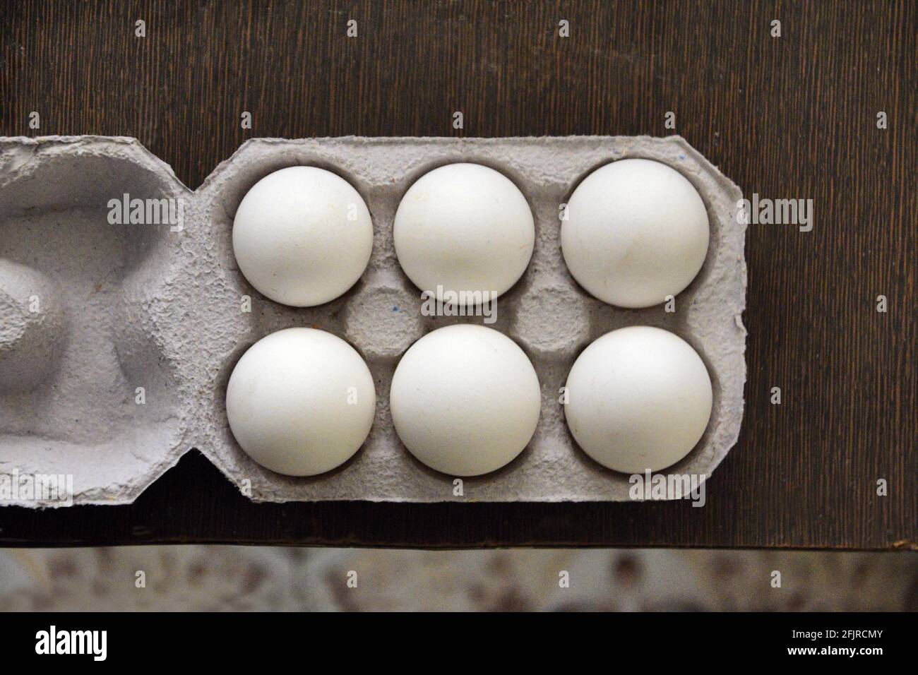 Six eggs in egg box Stock Photo - Alamy