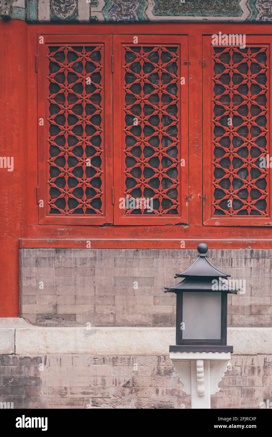 Lamp with red wall and spring flowers in the Forbidden City, Beijing ...