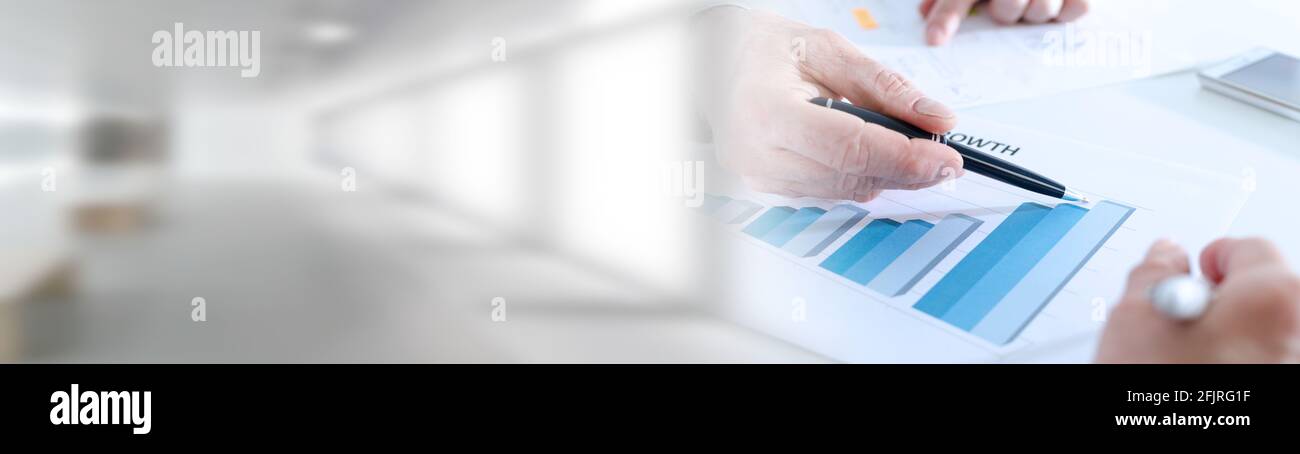 Analyzing growing results on a graphic; panoramic banner Stock Photo ...