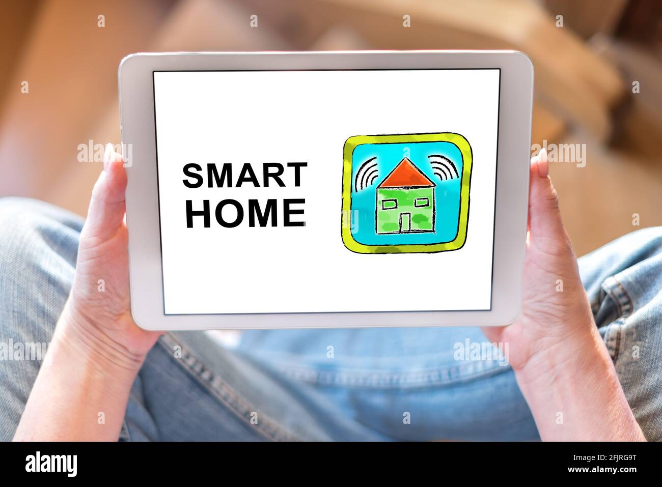 Tablet screen displaying a smart home concept Stock Photo - Alamy