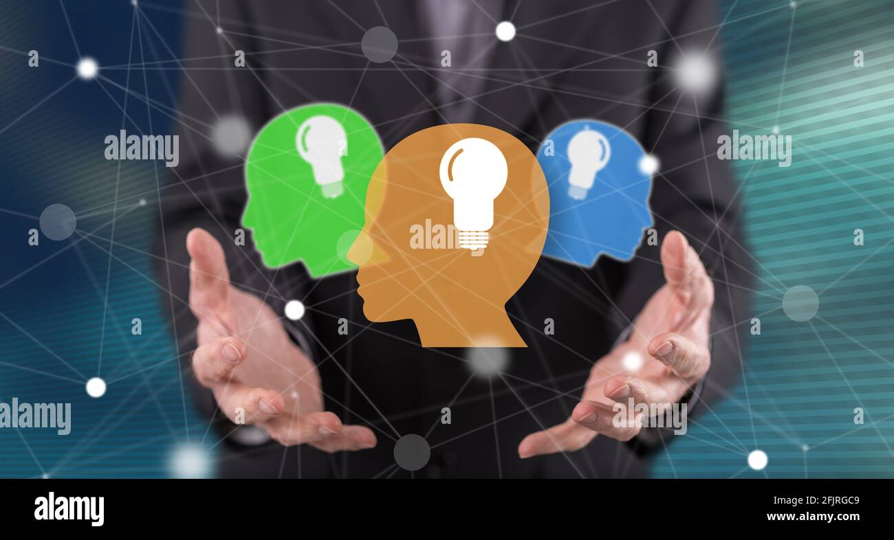 Human brain ideas concept above the hands of a man in background Stock ...