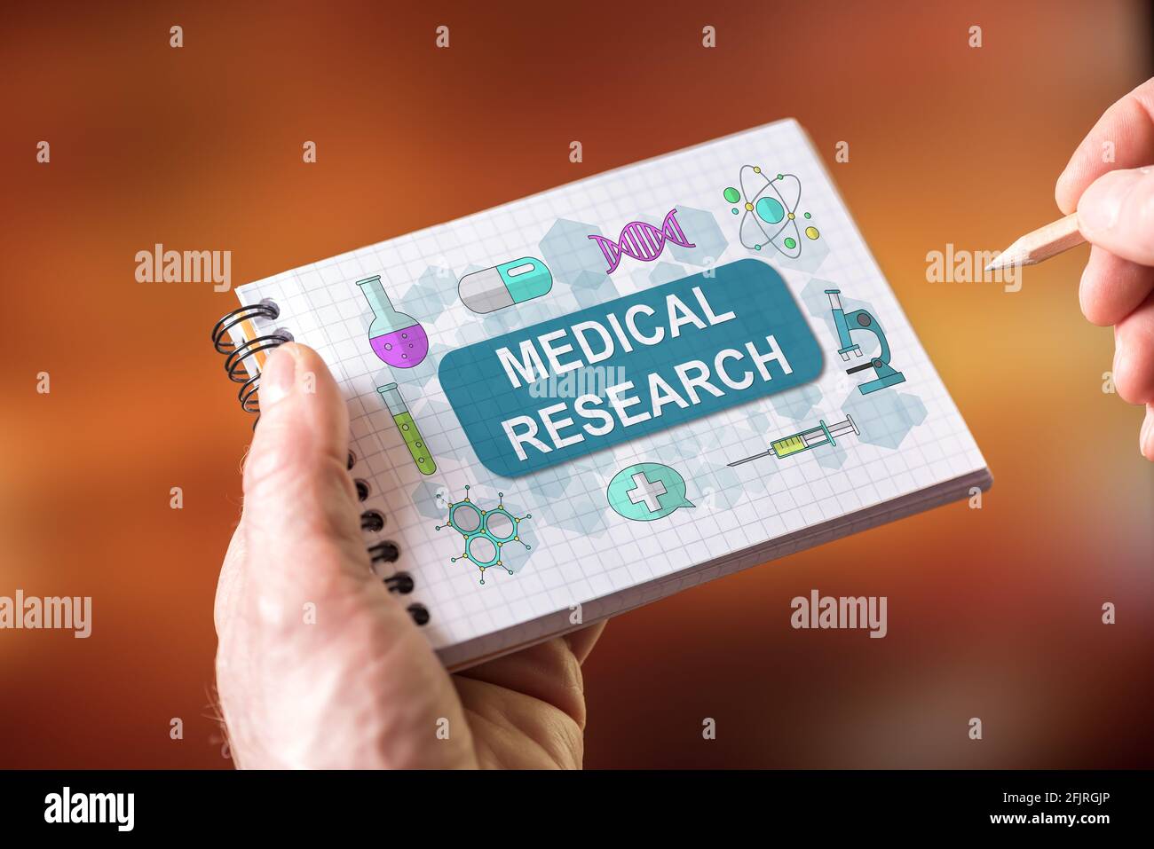 Hand drawing medical research concept on a notepad Stock Photo - Alamy