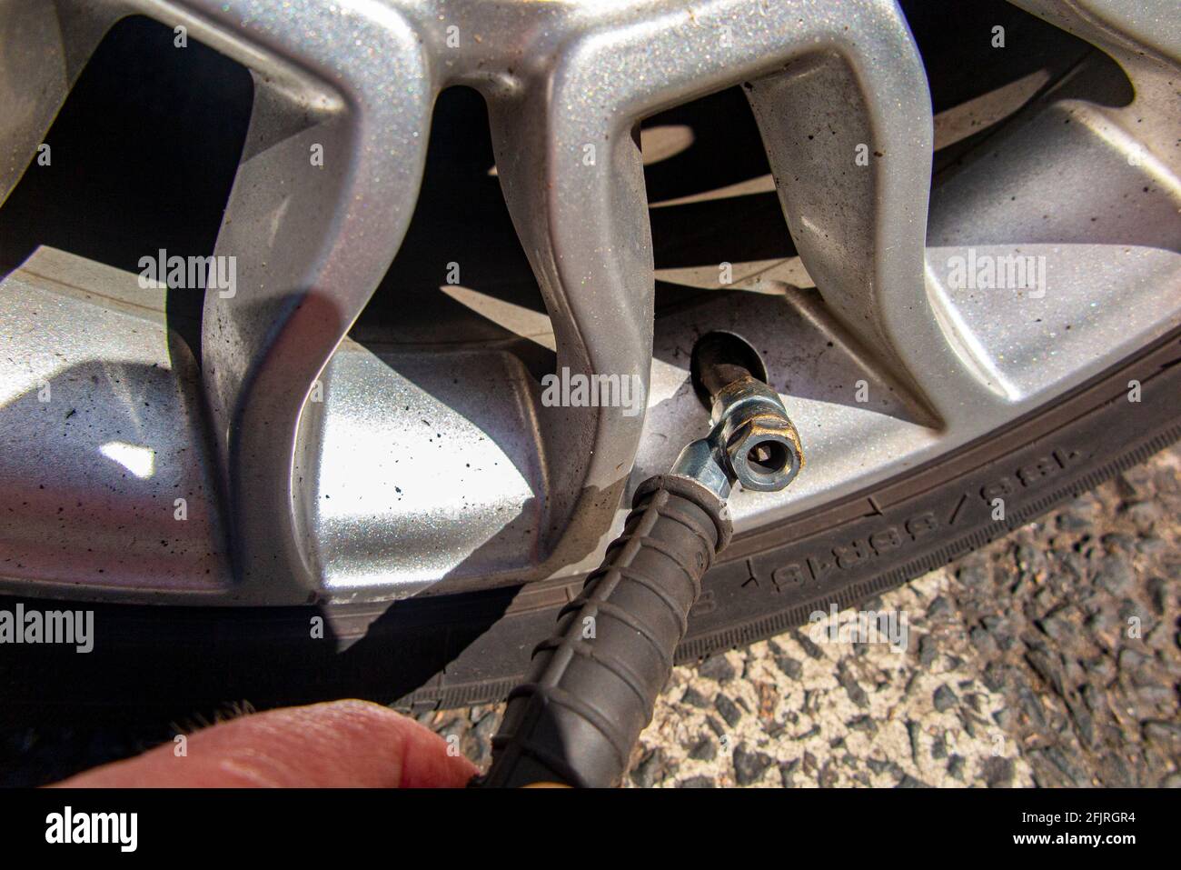 Filling a low profile tyre with air Stock Photo - Alamy