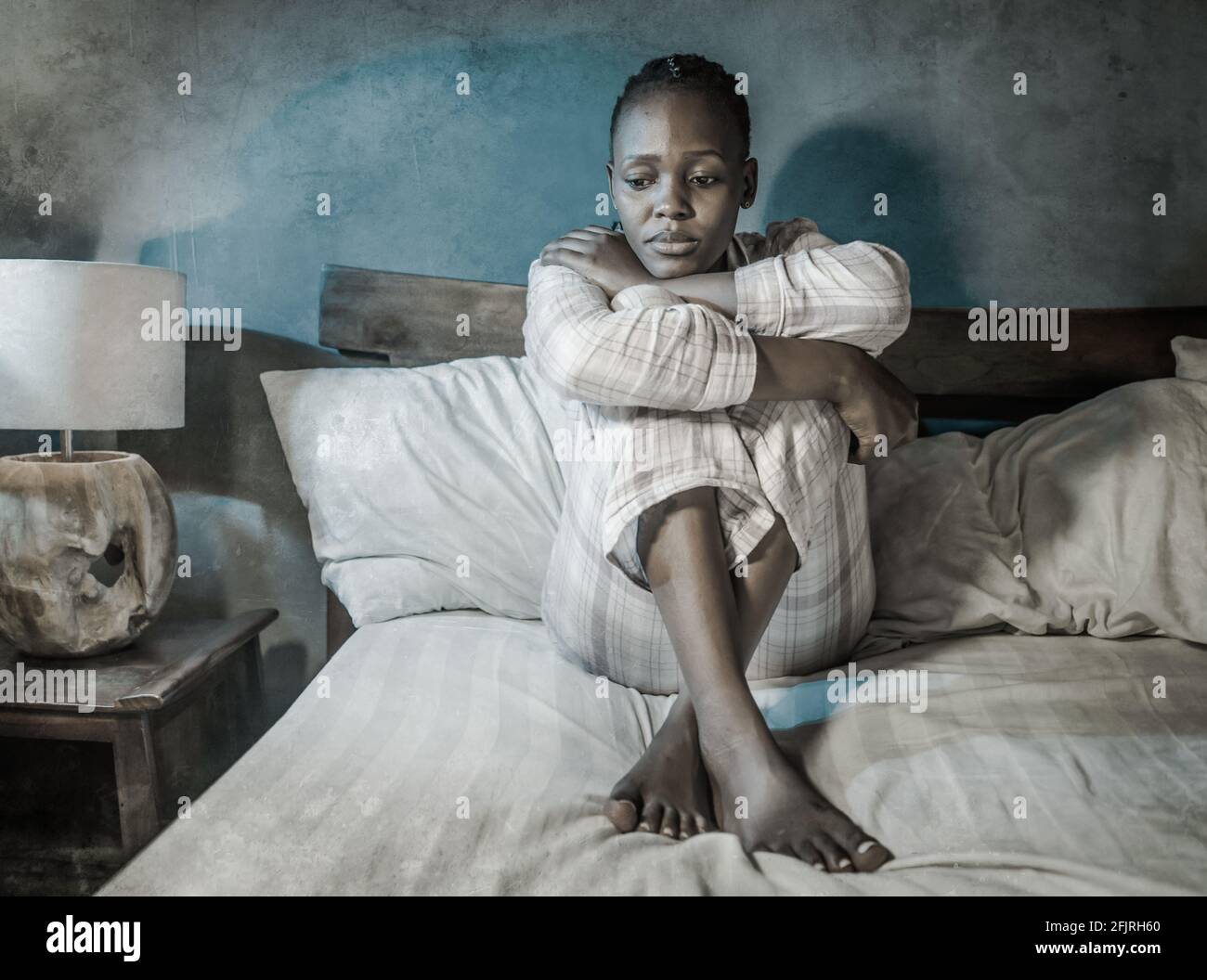 young African American girl at night suffering depression and insomnia ...