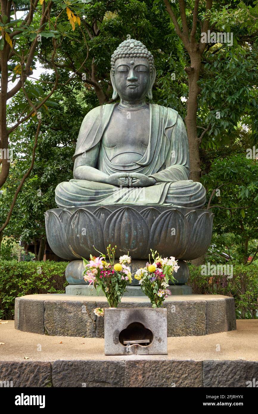 The view of stone statue of Amida Buddha (Nyorai image) sitting in ...