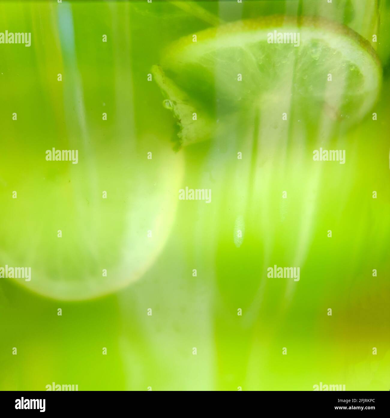 Lemonade in green glass, lemon drink food background Stock Photo - Alamy