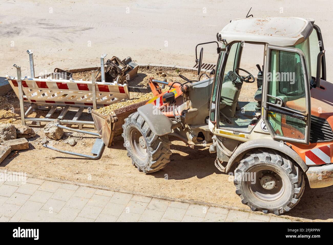 Road construction site with excavator and sand, road construction work ...