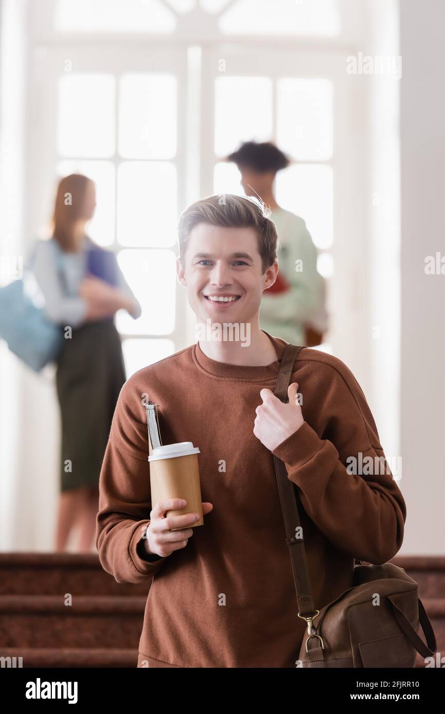 Cheerful student holding notebook hi-res stock photography and images ...