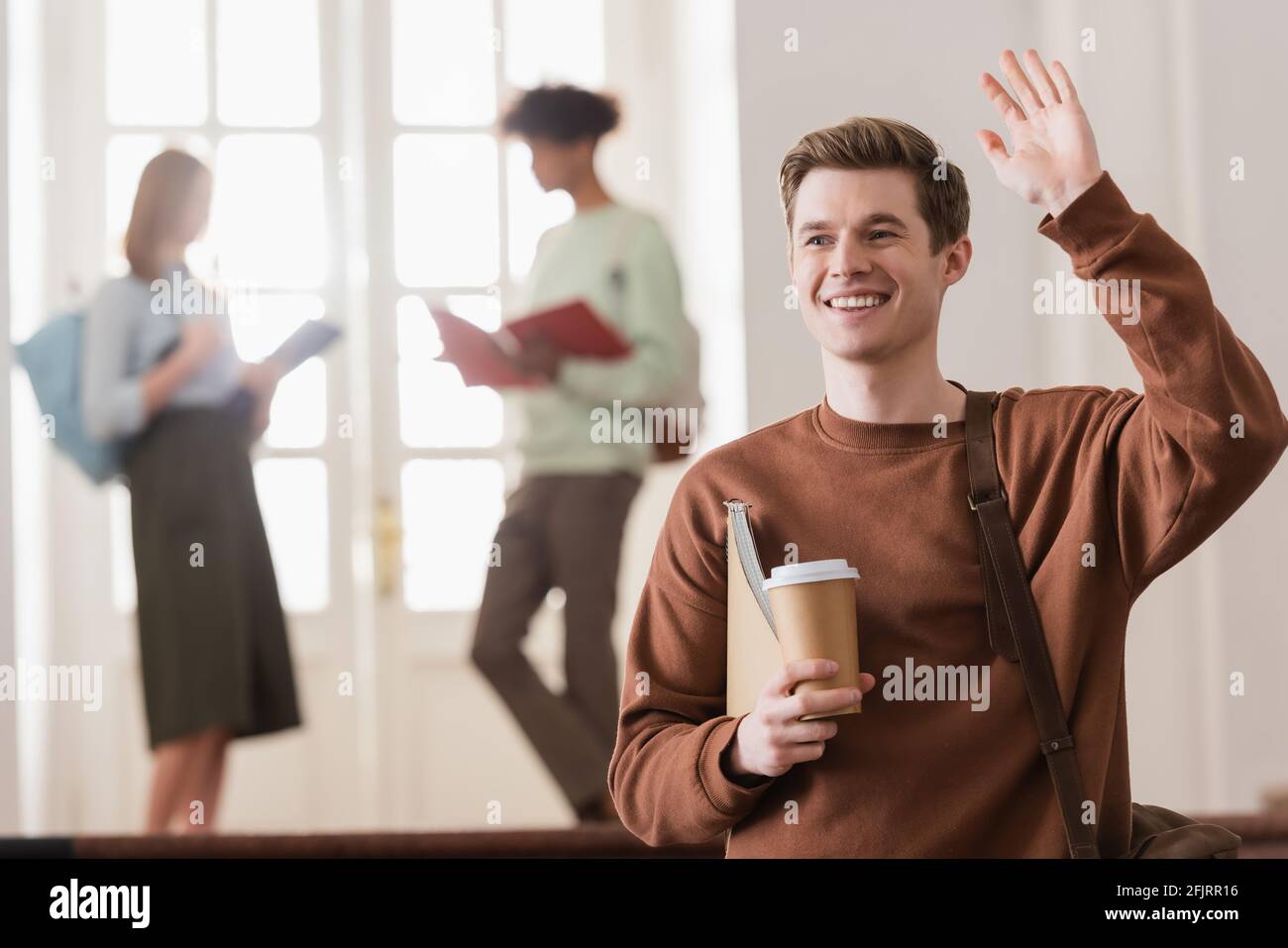 Students waving hello hi-res stock photography and images - Alamy