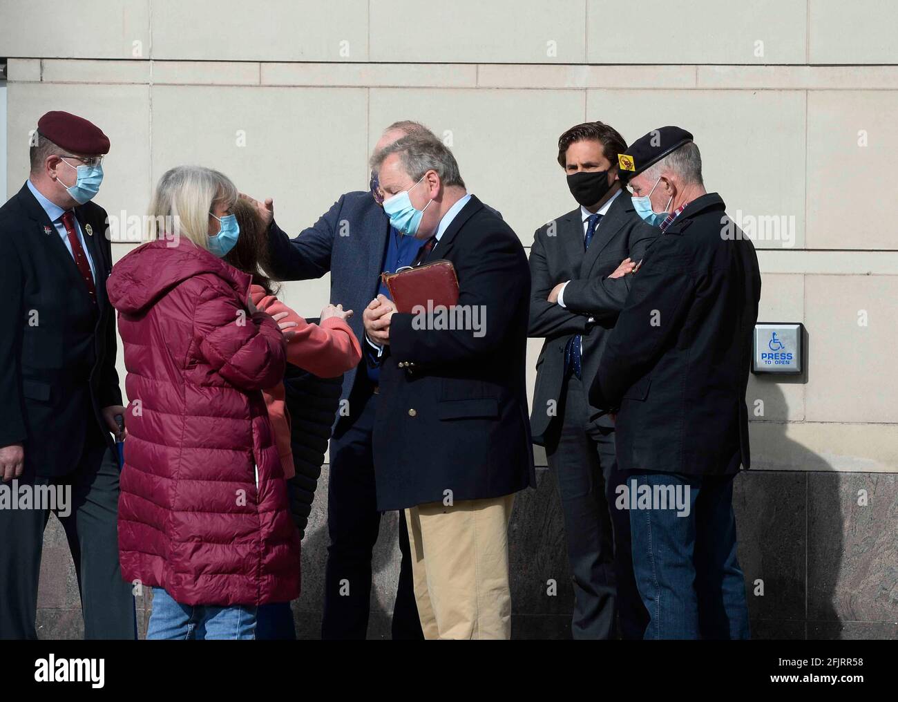 Ex veterans commissioner Johnny Mercer (2nd right) outside Laganside ...