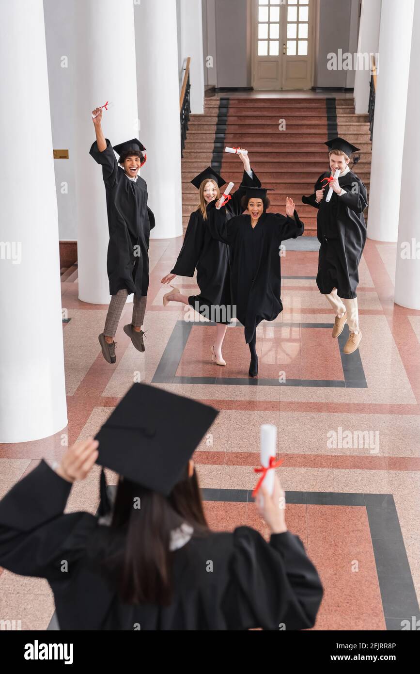Graduates jumping hi-res stock photography and images - Alamy