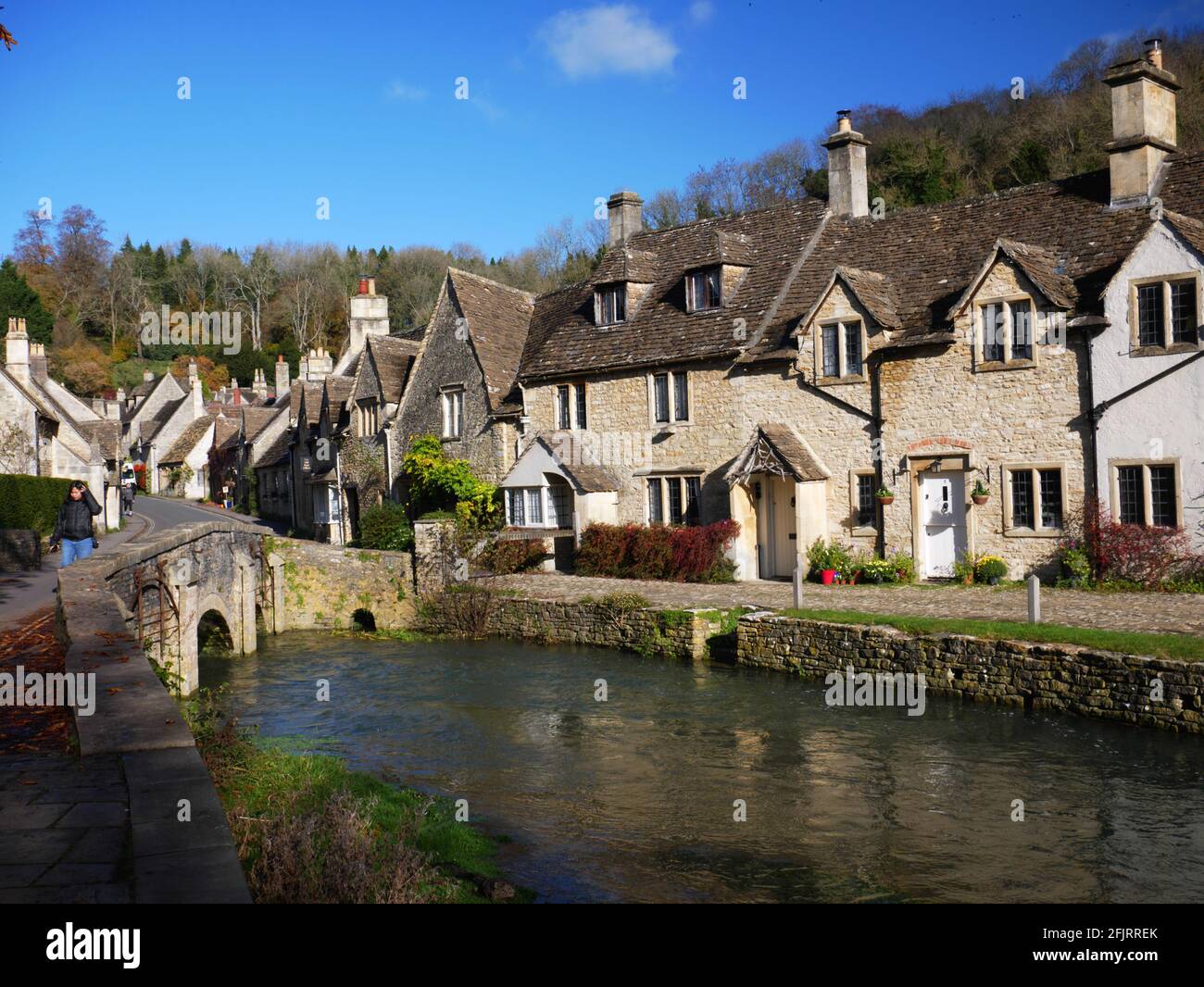 The River Bybrook flows through Castle Combe in Wiltshire Stock Photo ...