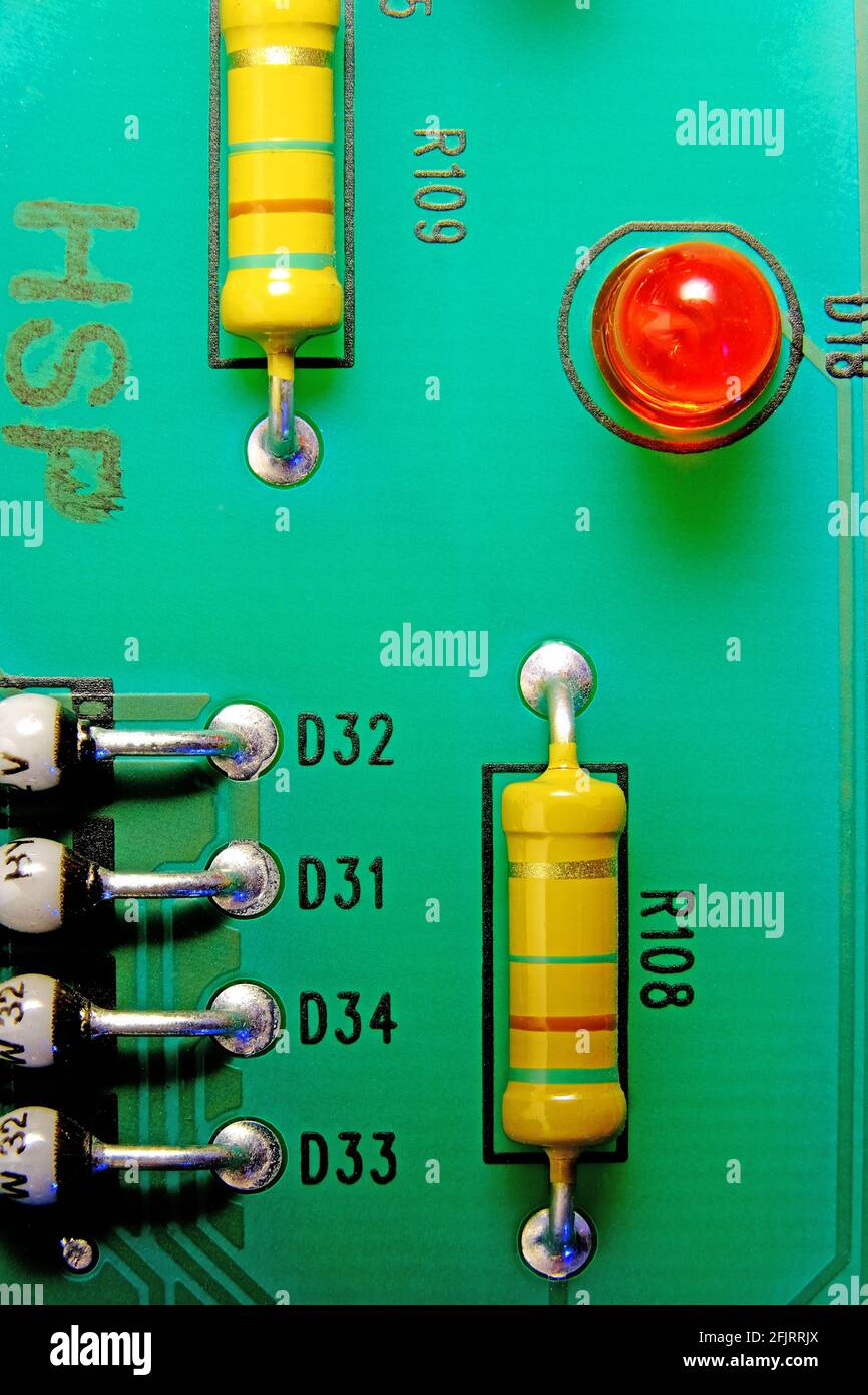 Circuit board and transistors with red warning light and green ...