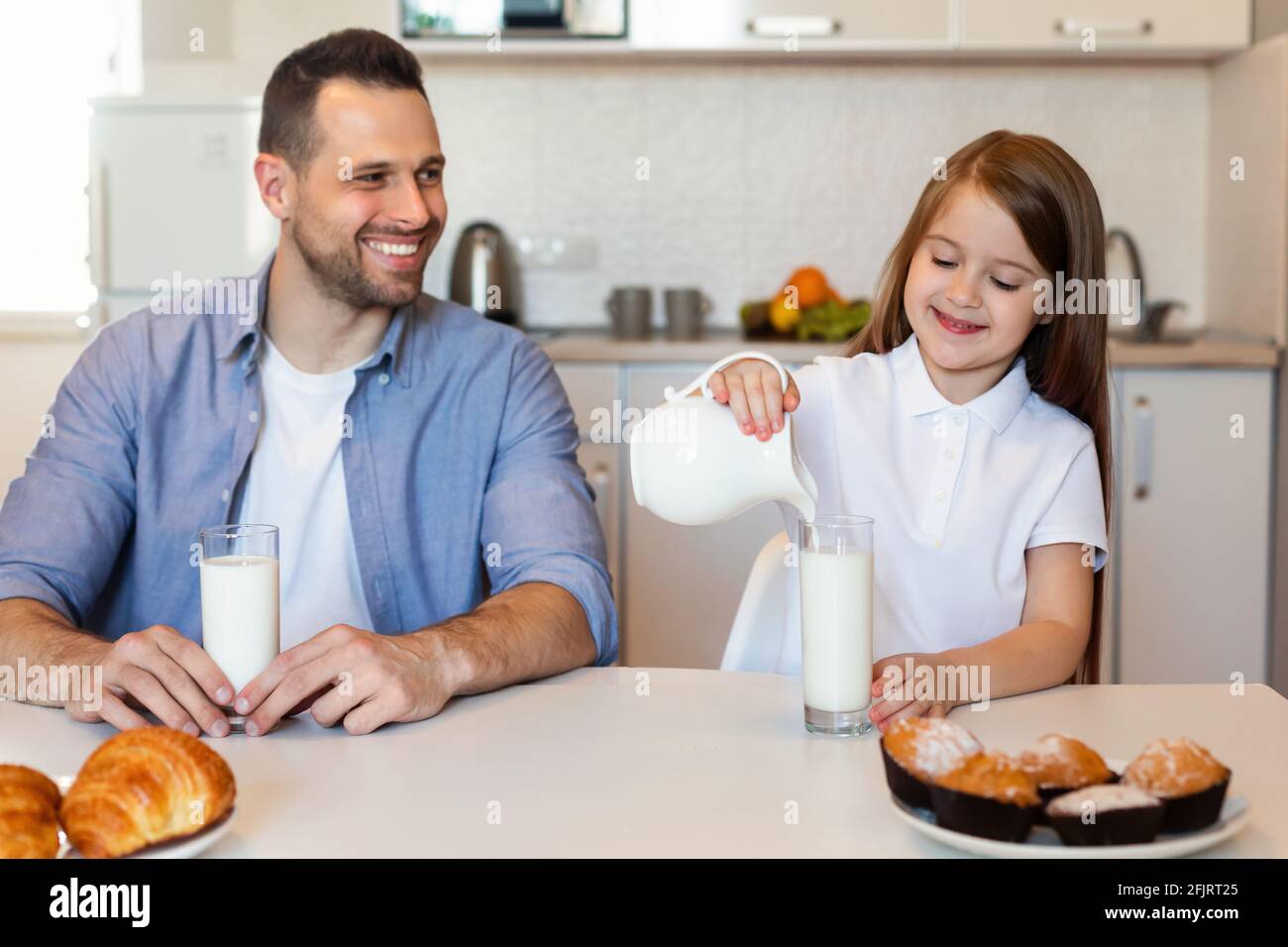 Kid pouring milk hi-res stock photography and images - Alamy