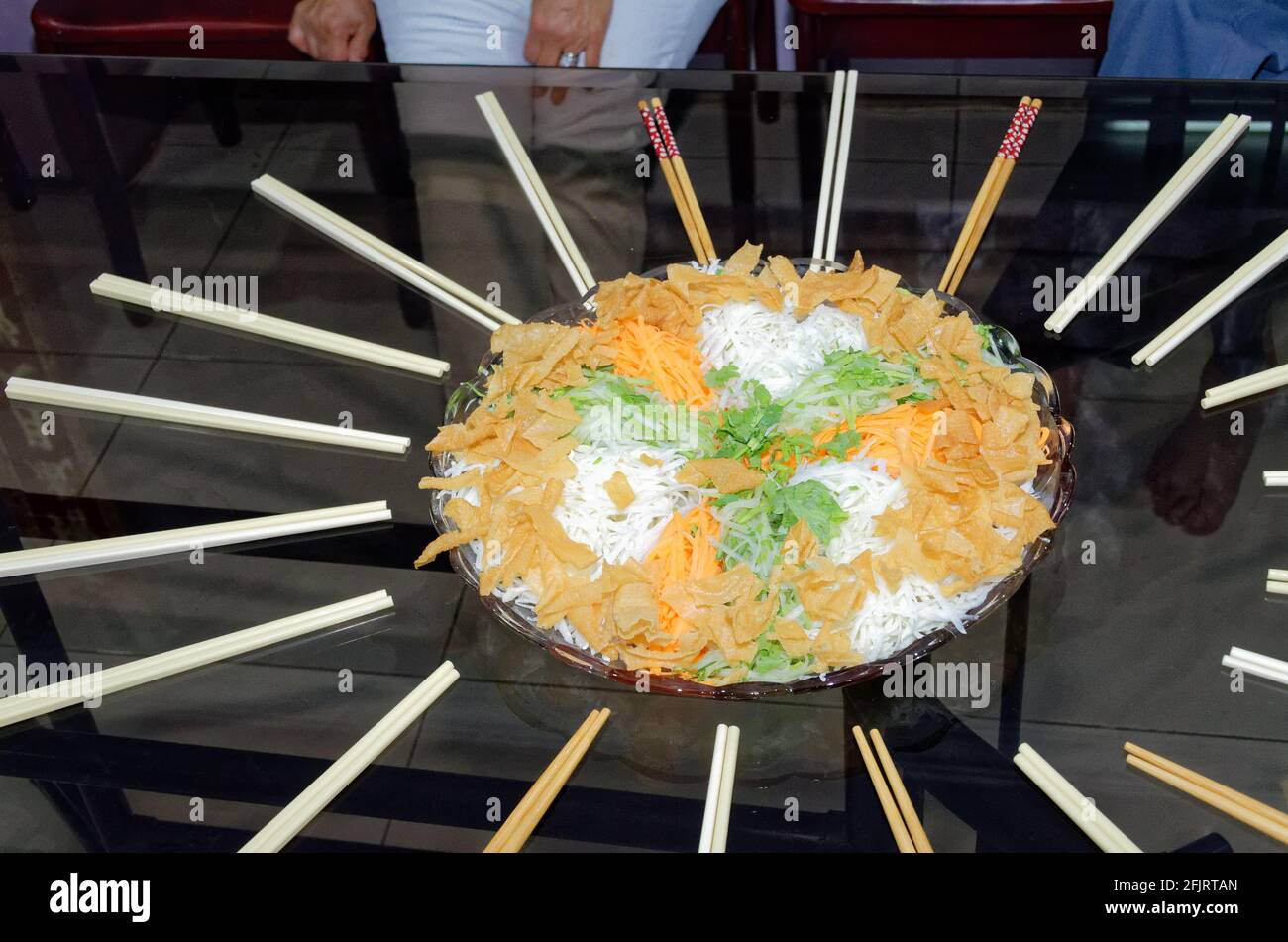 Yusheng, a traditional dish used to celebrate Chinese New Year and wish ...