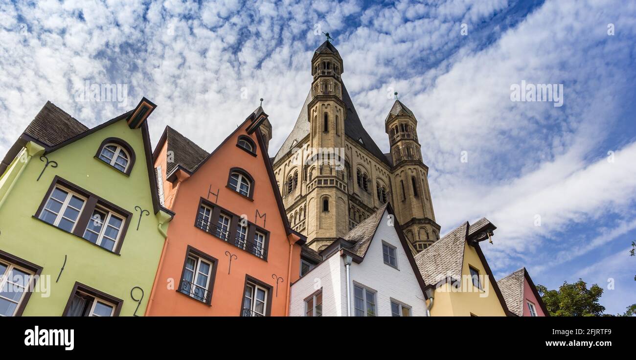 Panorama of colorful old houses and church tower at the fish market ...