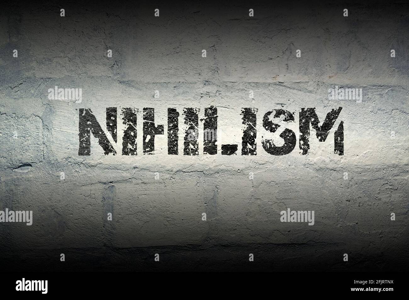 nihilism word stencil print on the grunge white brick wall Stock Photo ...