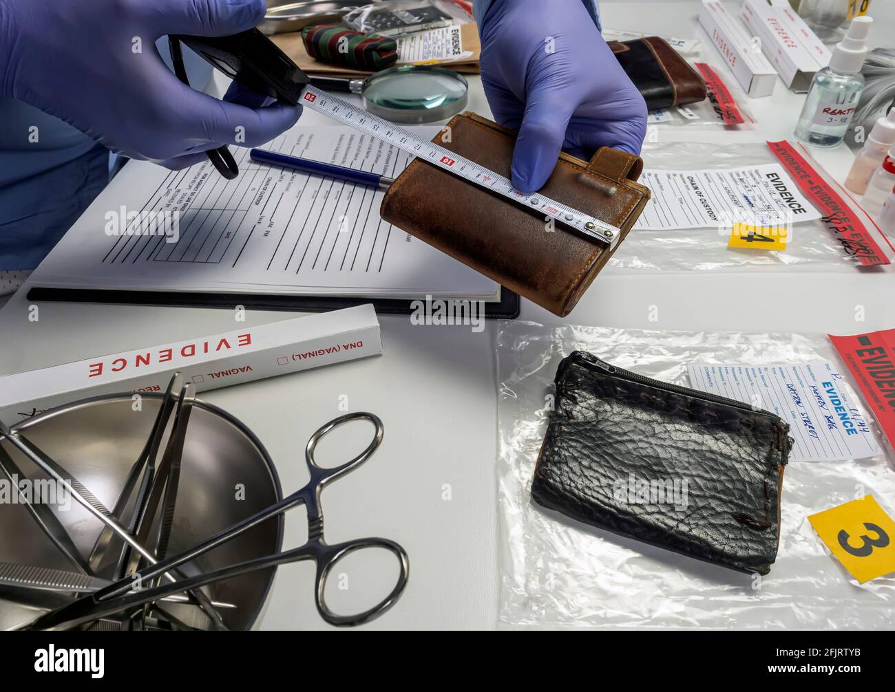 Specialised police officer measures wallet in crime lab, conceptual ...