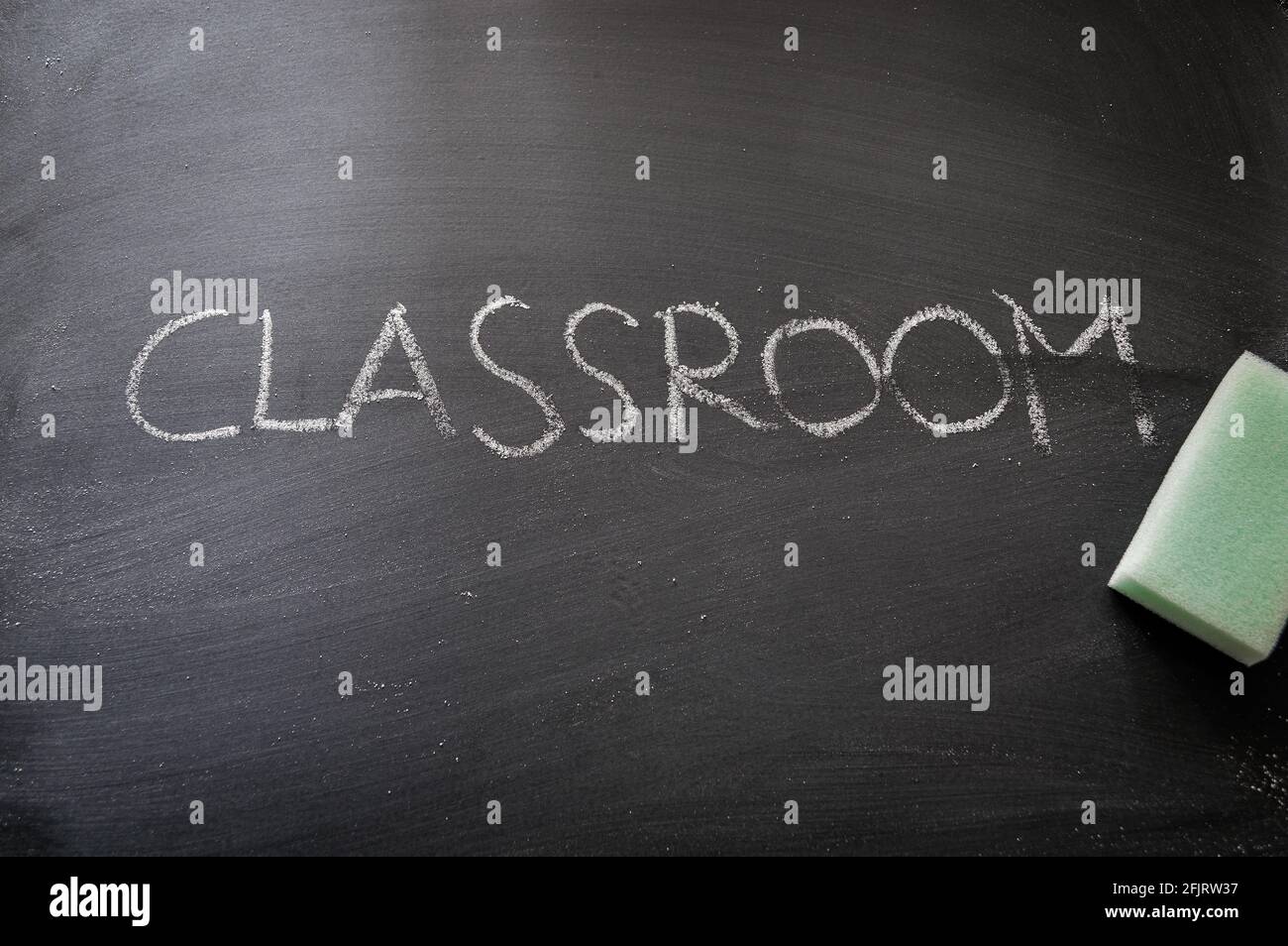 erasing classroom, hand written word on blackboard being erased concept ...