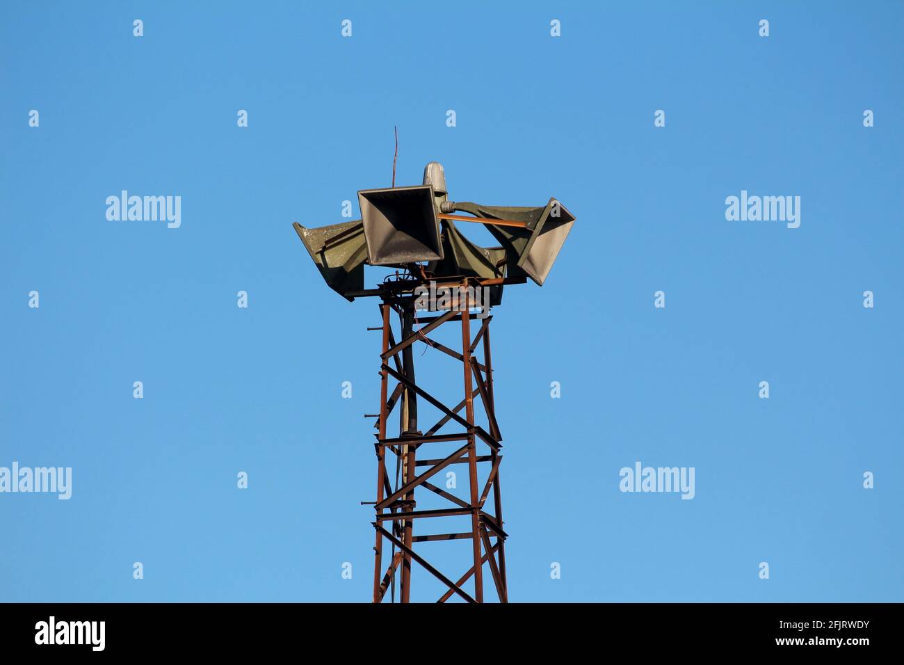 Four large public civil defence warning air sirens mounted on top of ...