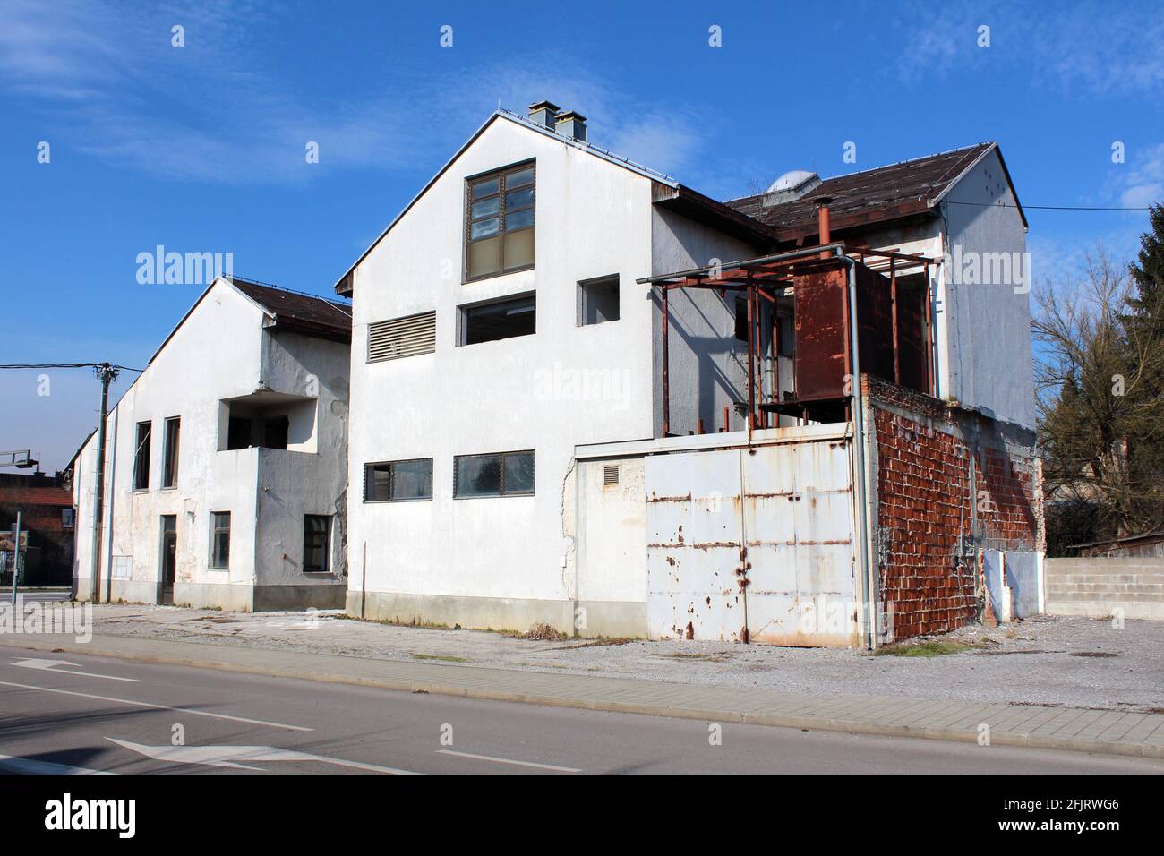 Large abandoned suburban family house with cracked dilapidated white ...