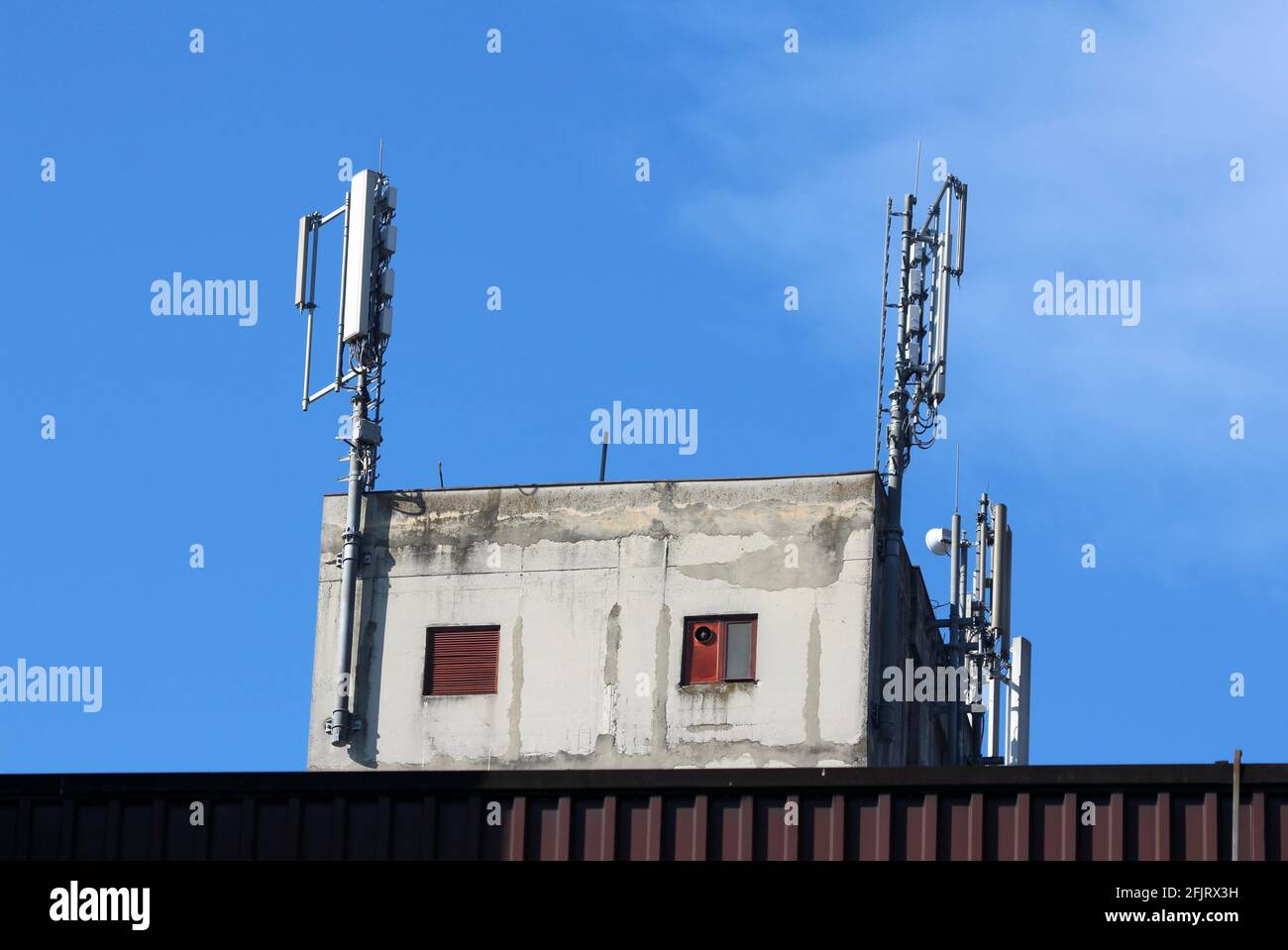 Top floor of old dilapidated concrete industrial building with two ...