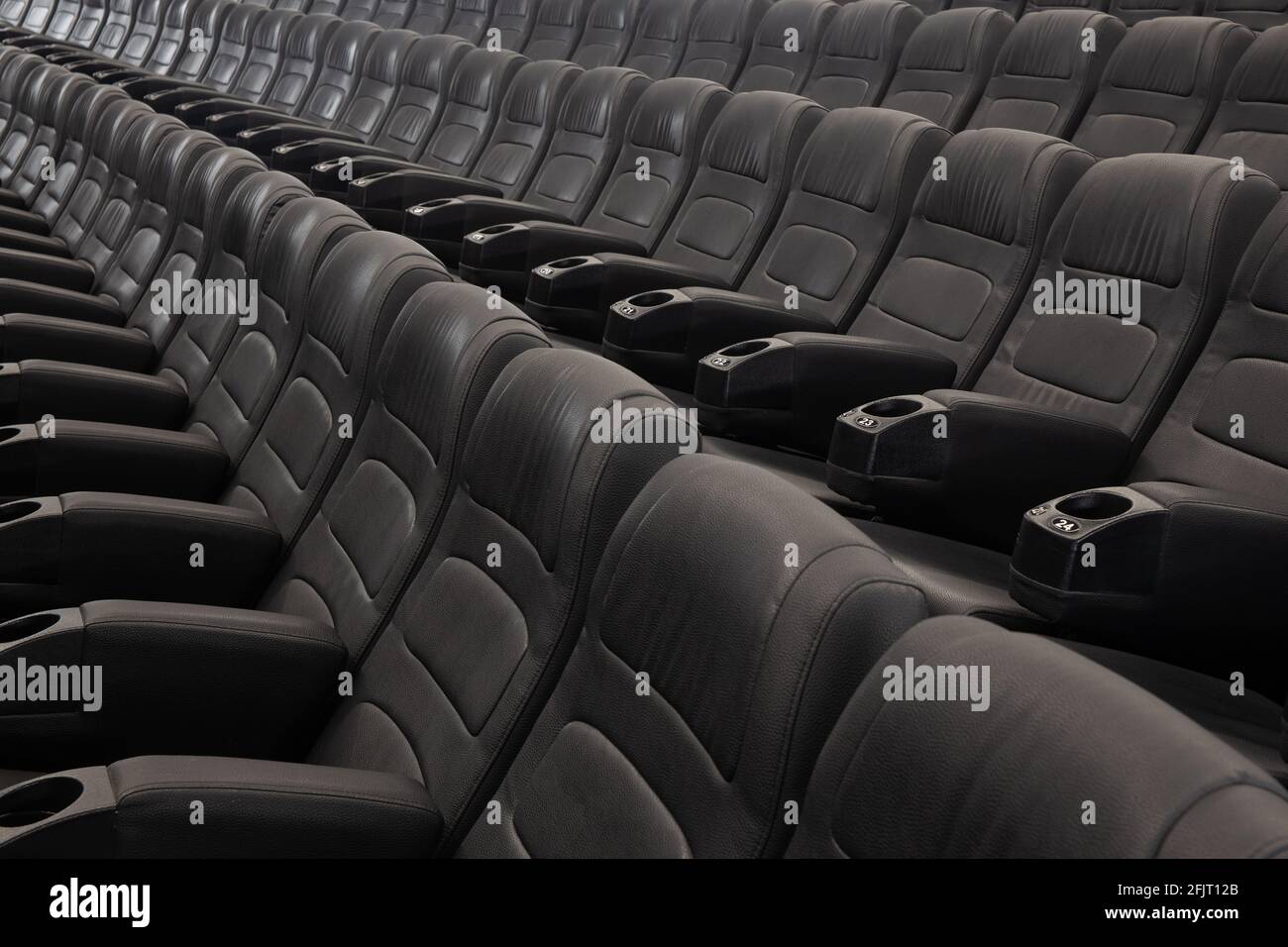 Empty Black Leather Seats In Row At Movie Theater - great entertainment ...